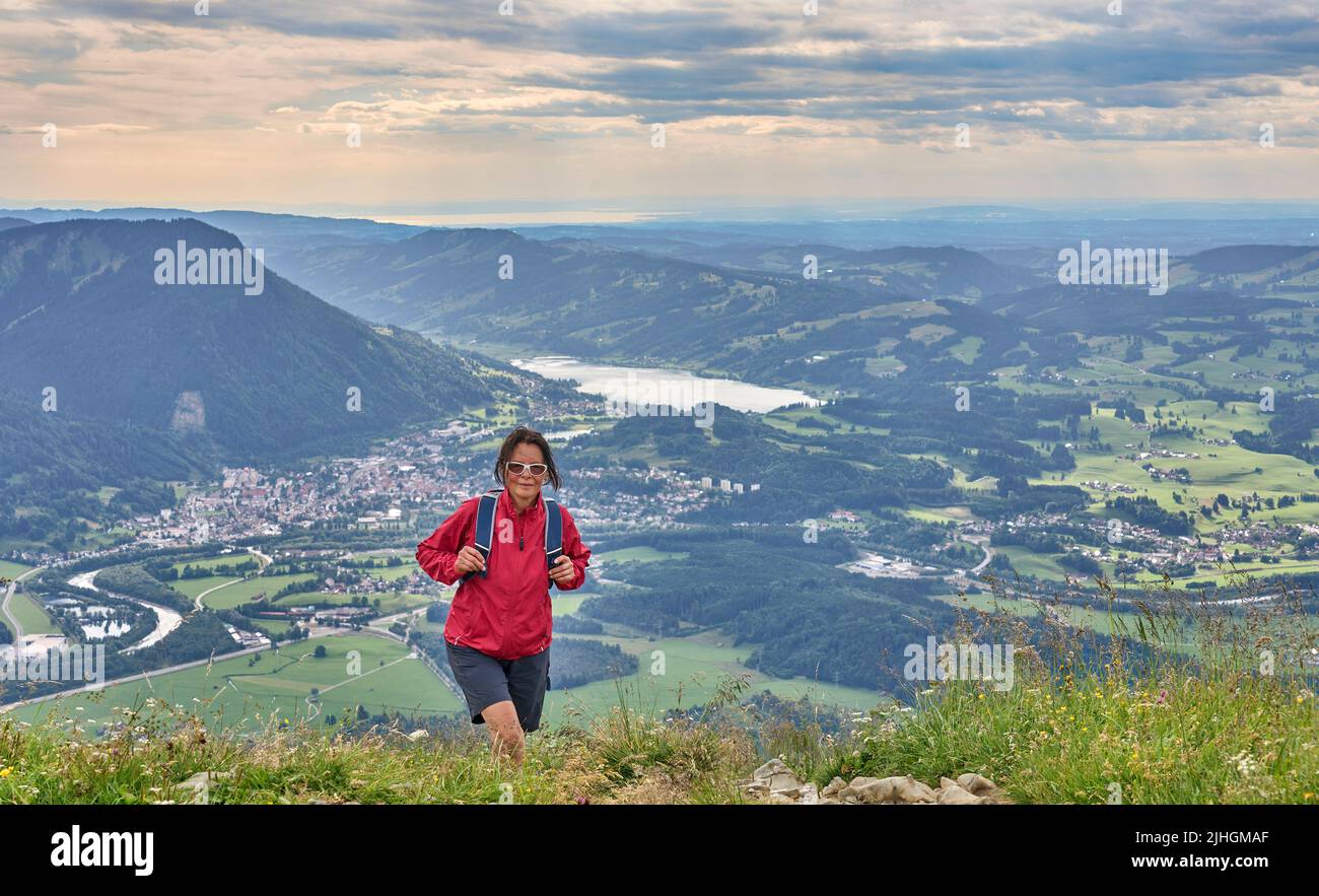 nice senior woman hiking at Mount Gruenten in the Allgaeu Alps with ...