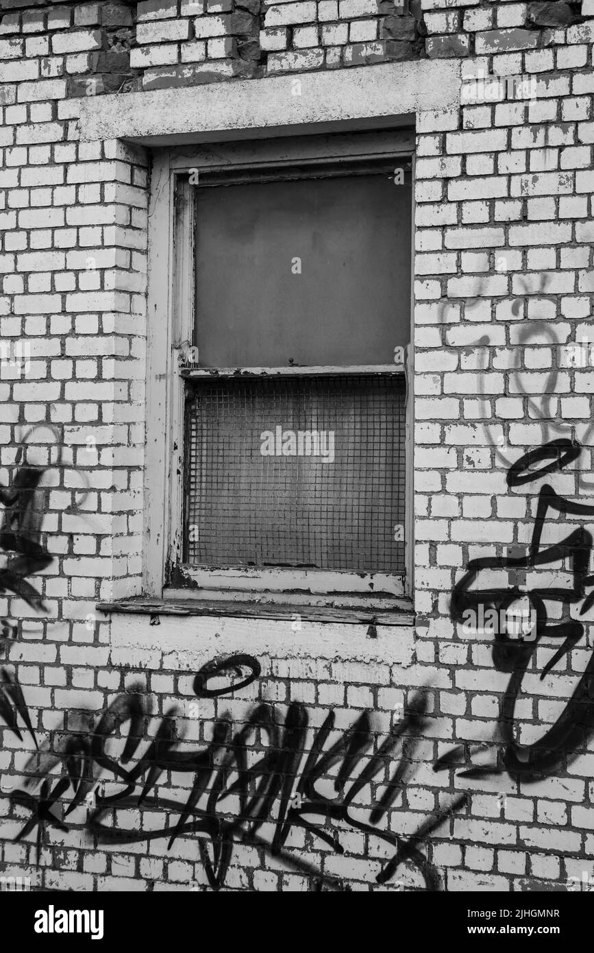 Graffiti on an wall of a derelict building with an old window Stock ...