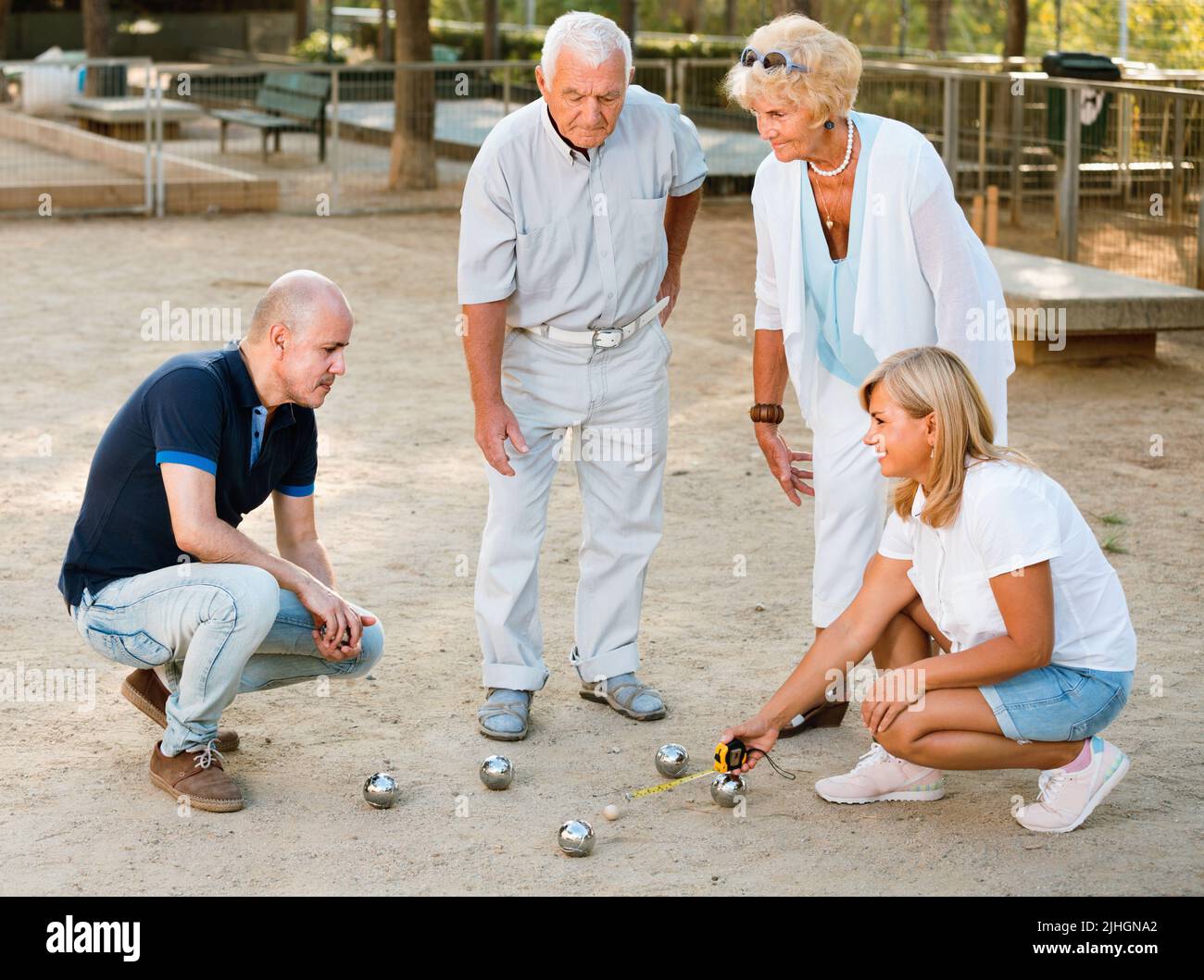 Happy family playing petanque in outdoor Stock Photo - Alamy