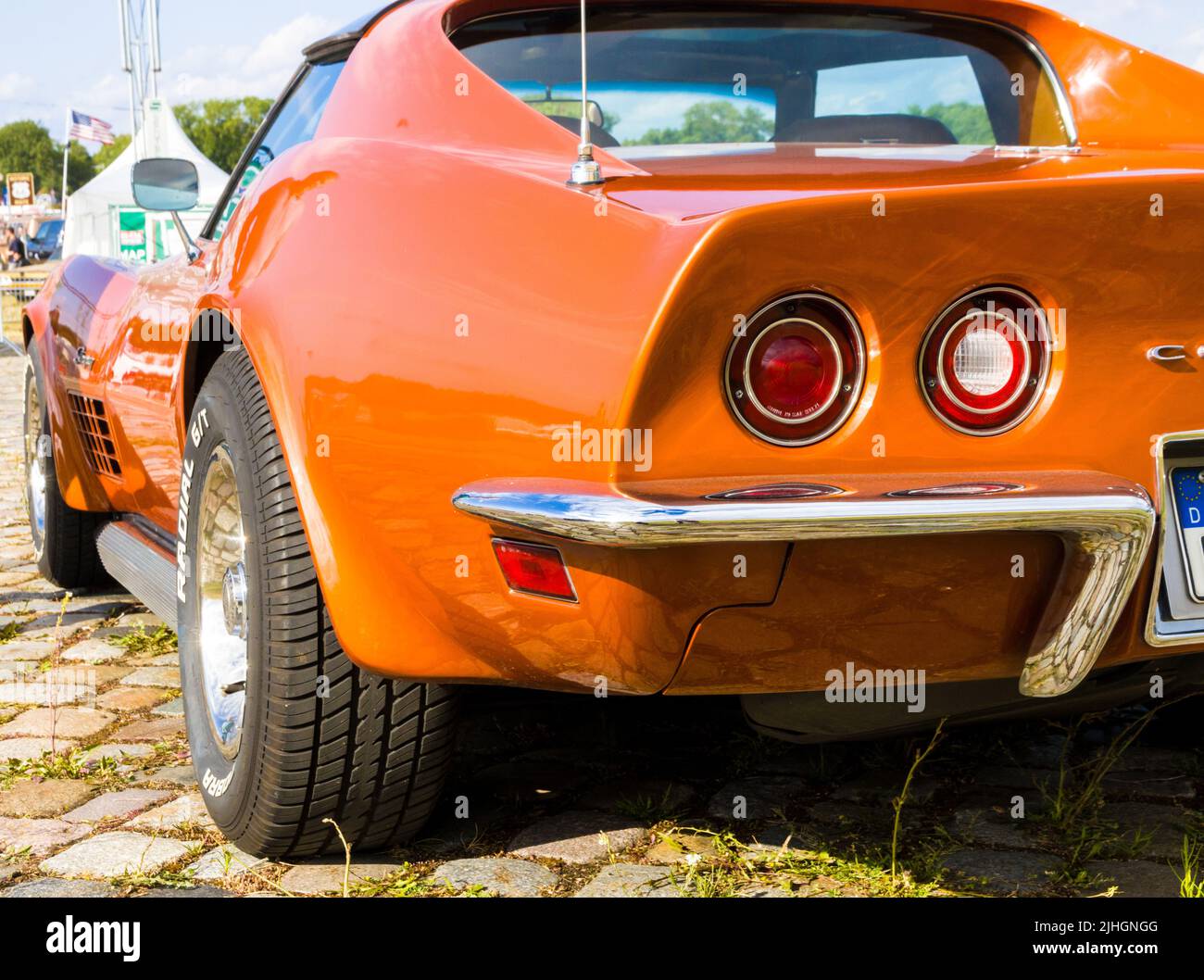 The original classic car Chevrolet Corvette in orange Stock Photo - Alamy