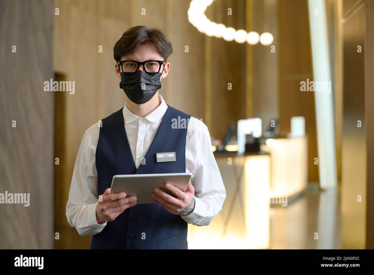 Hotel receptionist tablet hi-res stock photography and images - Alamy