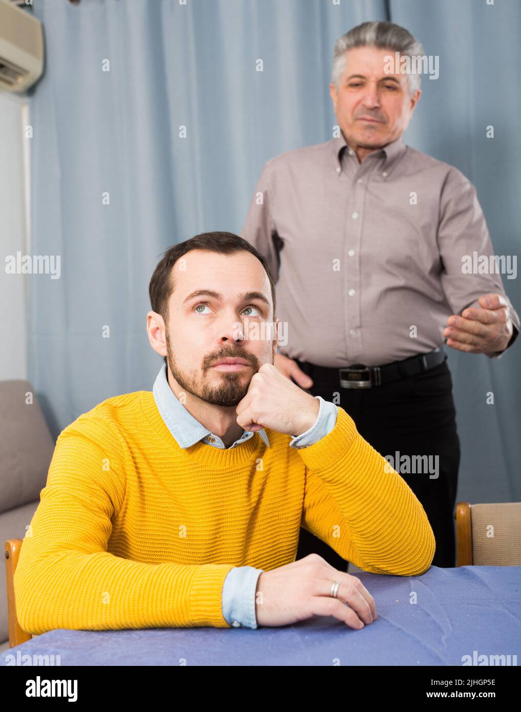 Adult father teaches his son Stock Photo - Alamy