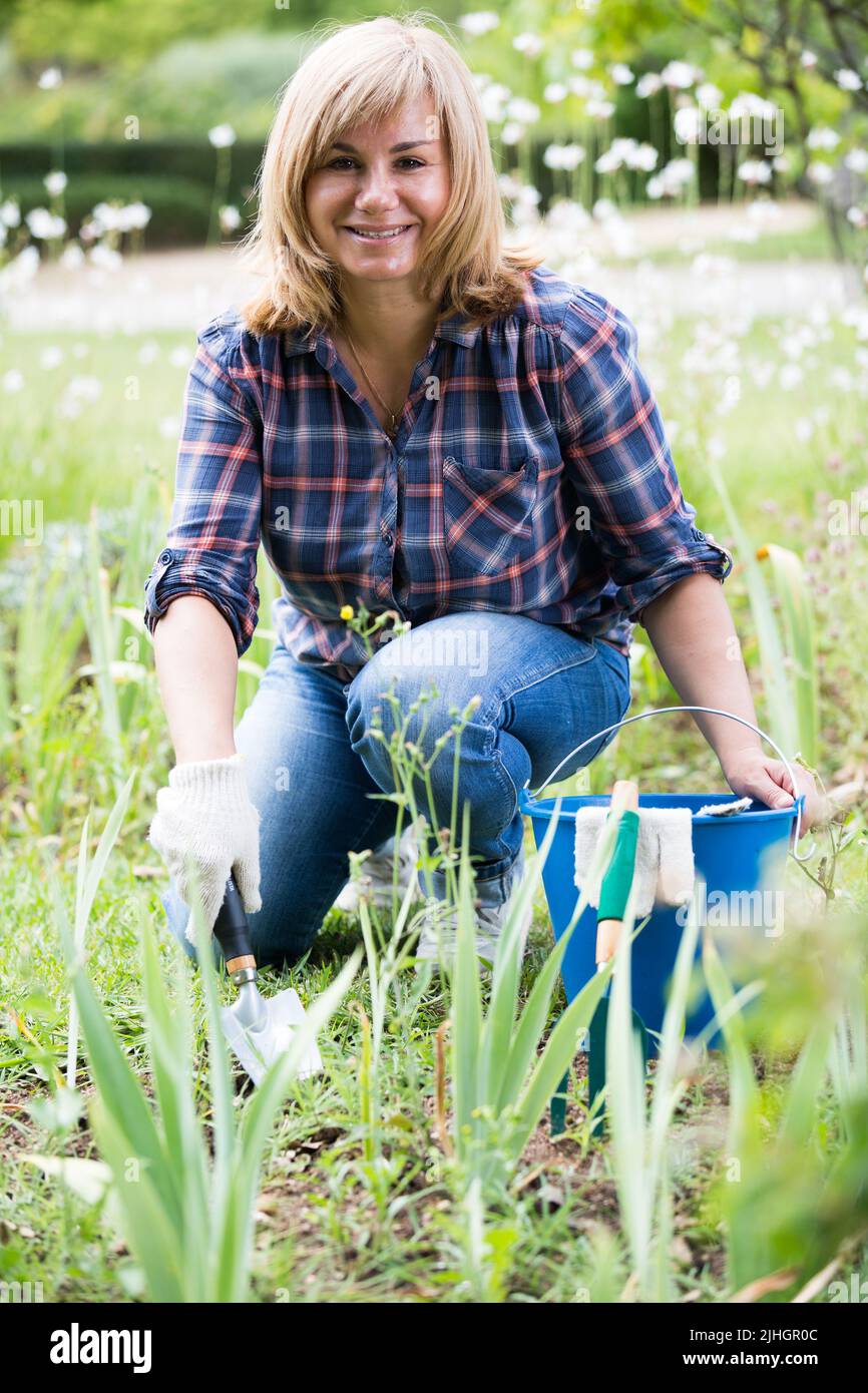 woman planting flower Stock Photo - Alamy