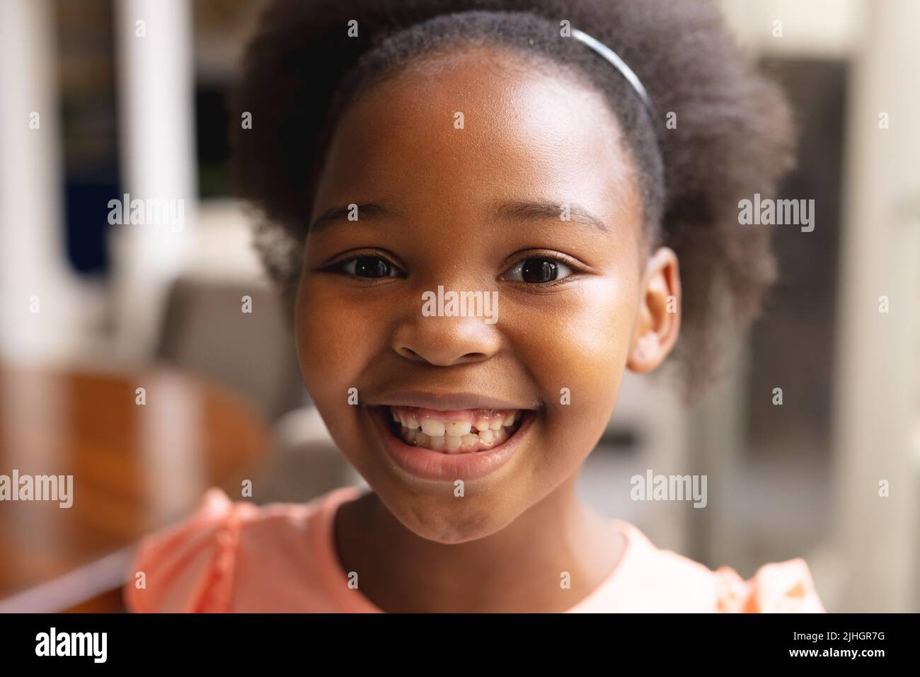 Image of happy african american girl looking at camera Stock Photo - Alamy