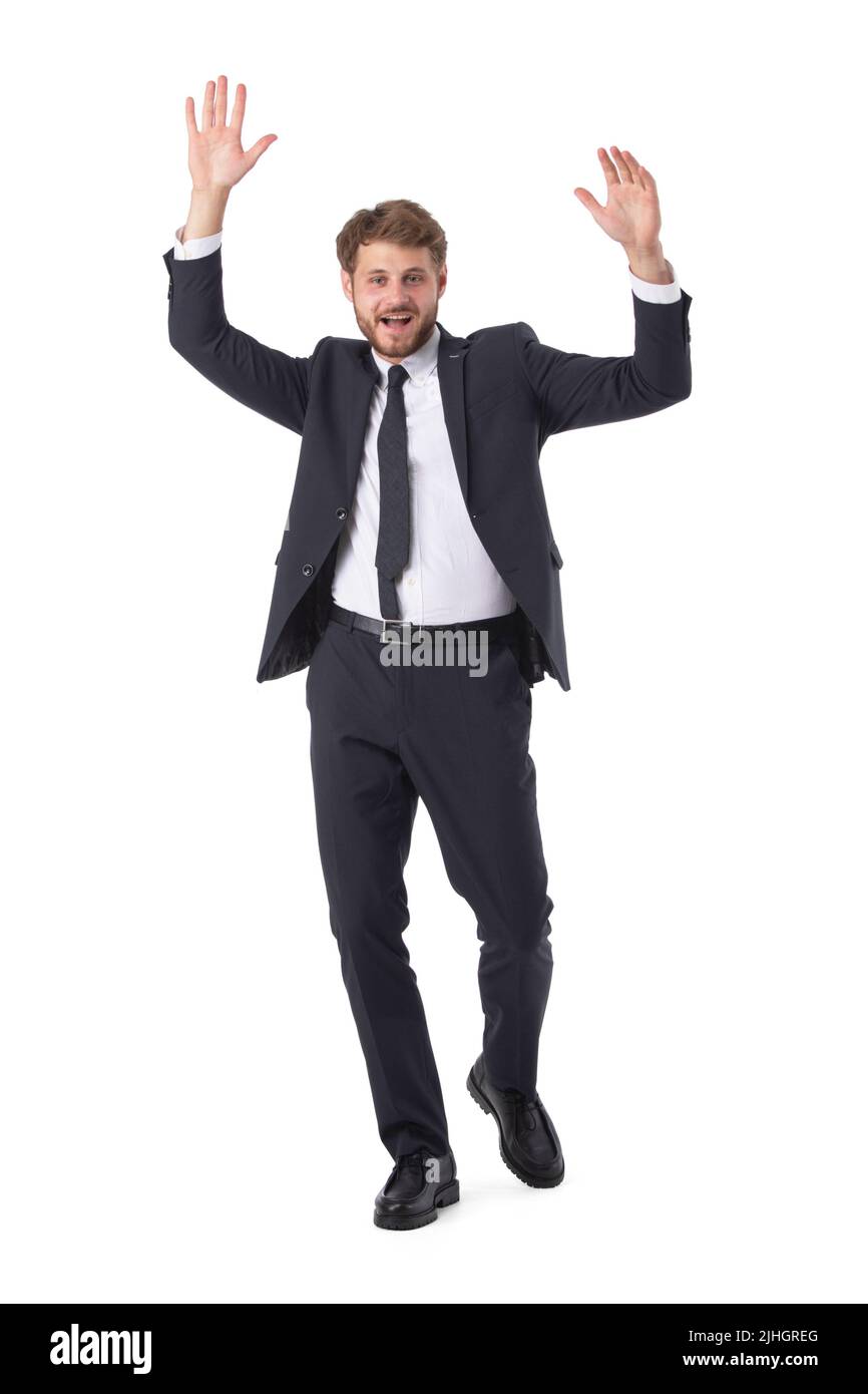 Business man wearing black suit posing with hands up winner concept ...