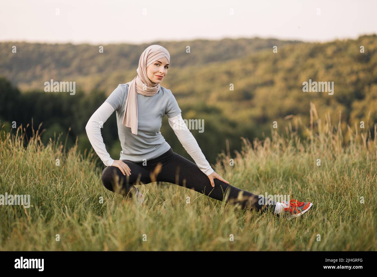Muslim, arab, islamic pretty slim woman in sporty outfit and hijab ...