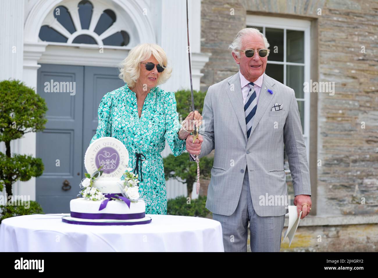 The Prince of Wales and the Duchess of Cornwall cutting the anniversary ...