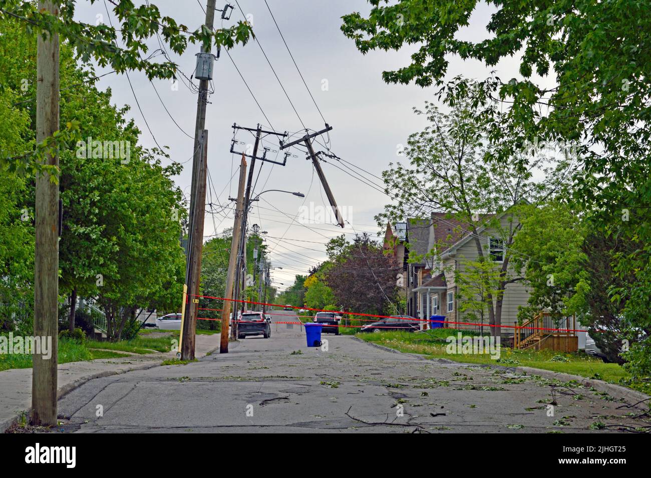 A power line post is snapped in half afer a massive storm Stock Photo ...