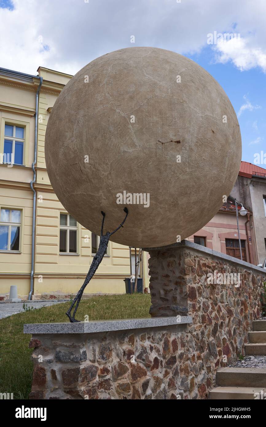 Rakovnik, Czech Republic - July 2, 2022 - the statue of a man rolls a ...