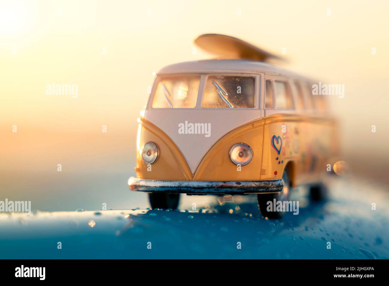 minibus with surfing on the roof in the rays of the setting sun Stock ...