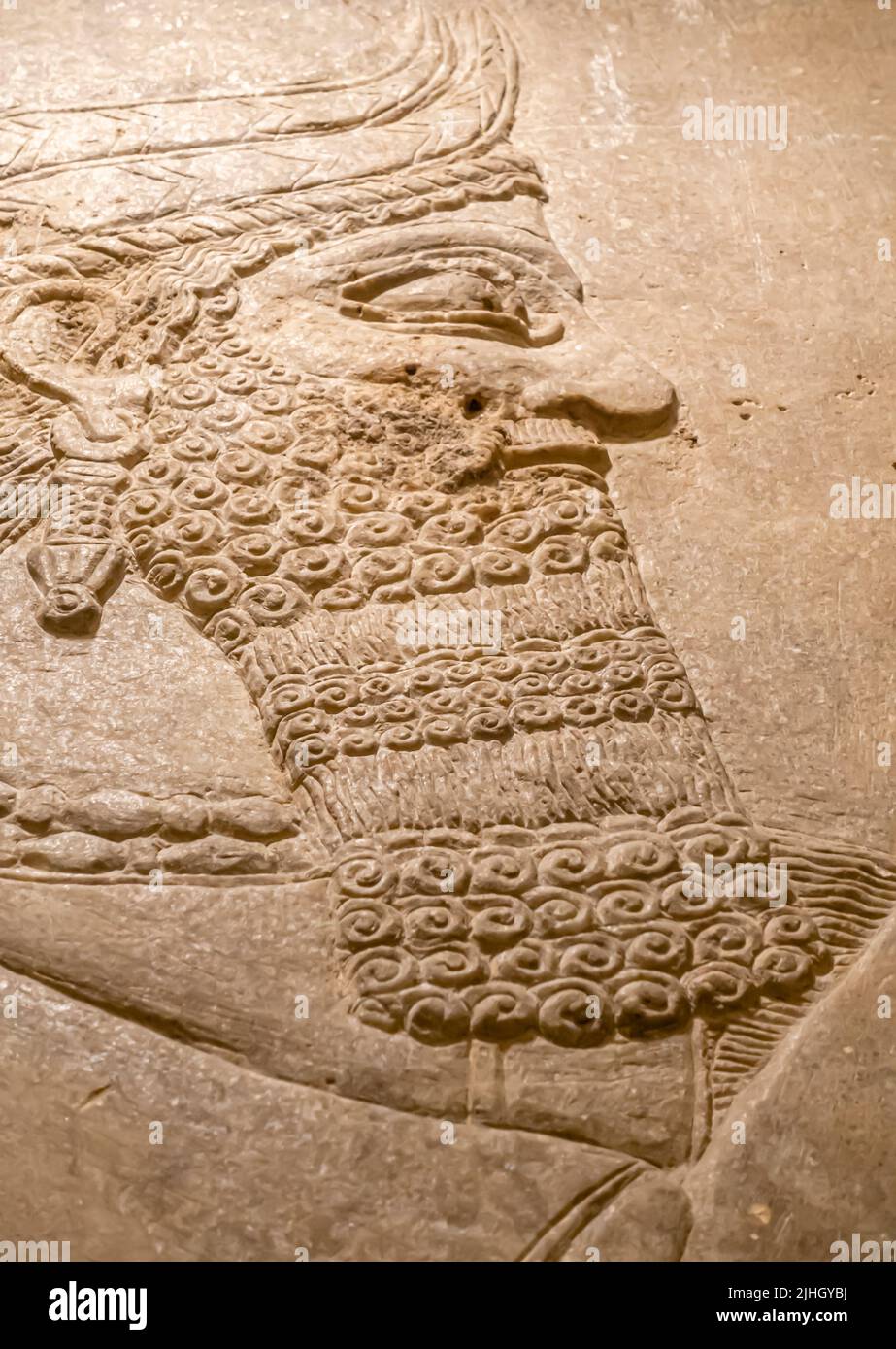 Deity by the sacred tree. Detail. Relief from the palace of ...