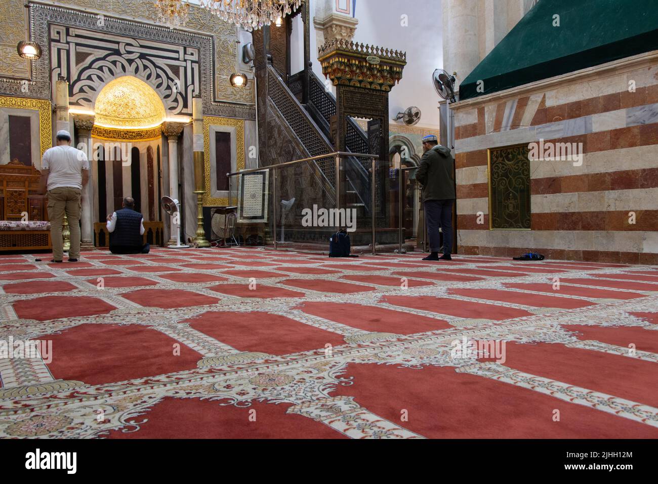 Muslim visitors praying in Abraham Mosque of Hebron. Tombs of Isaac and ...