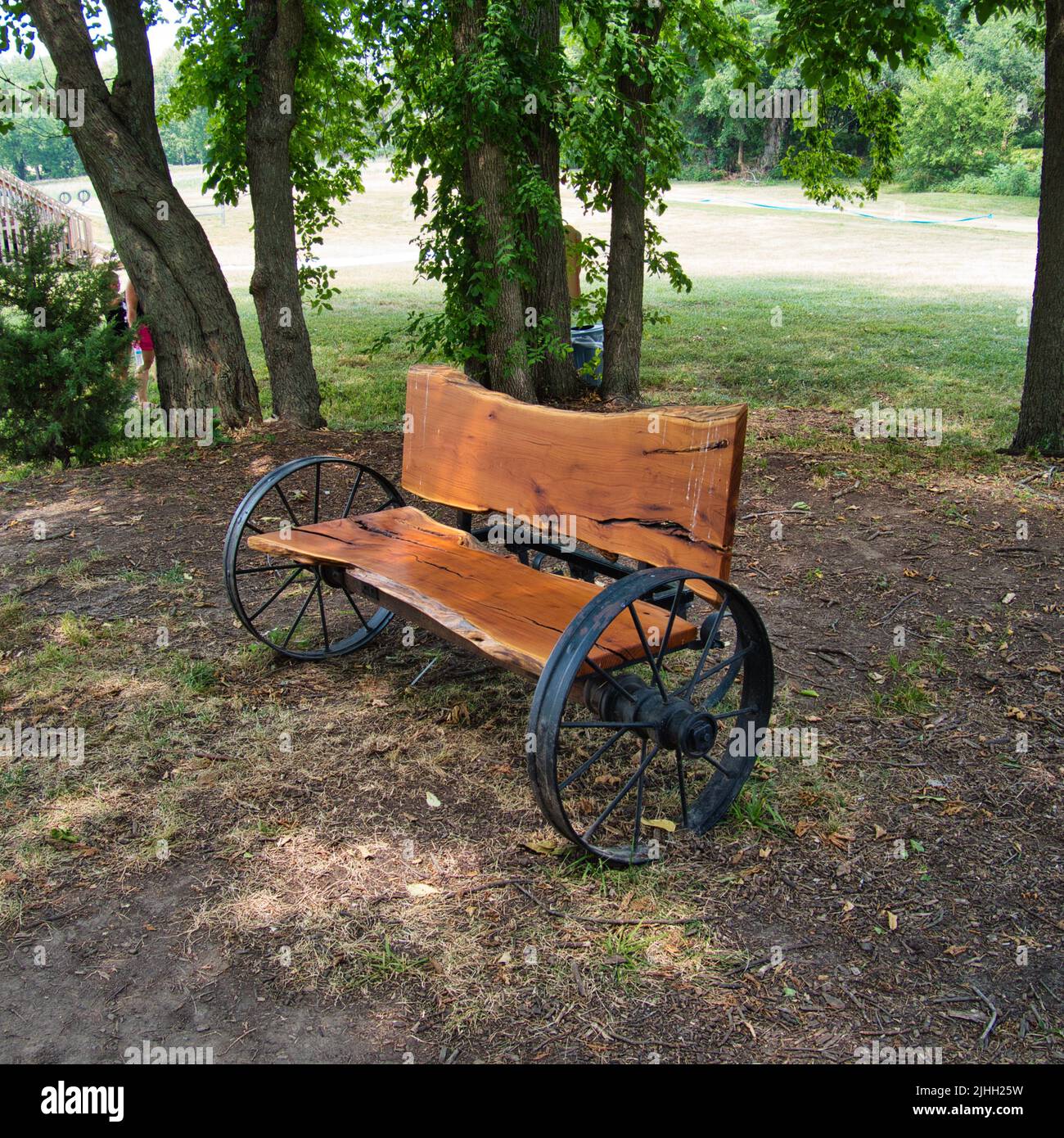 Old wooden bench with black steel wagon wheels in Edgerton Kansas Stock ...
