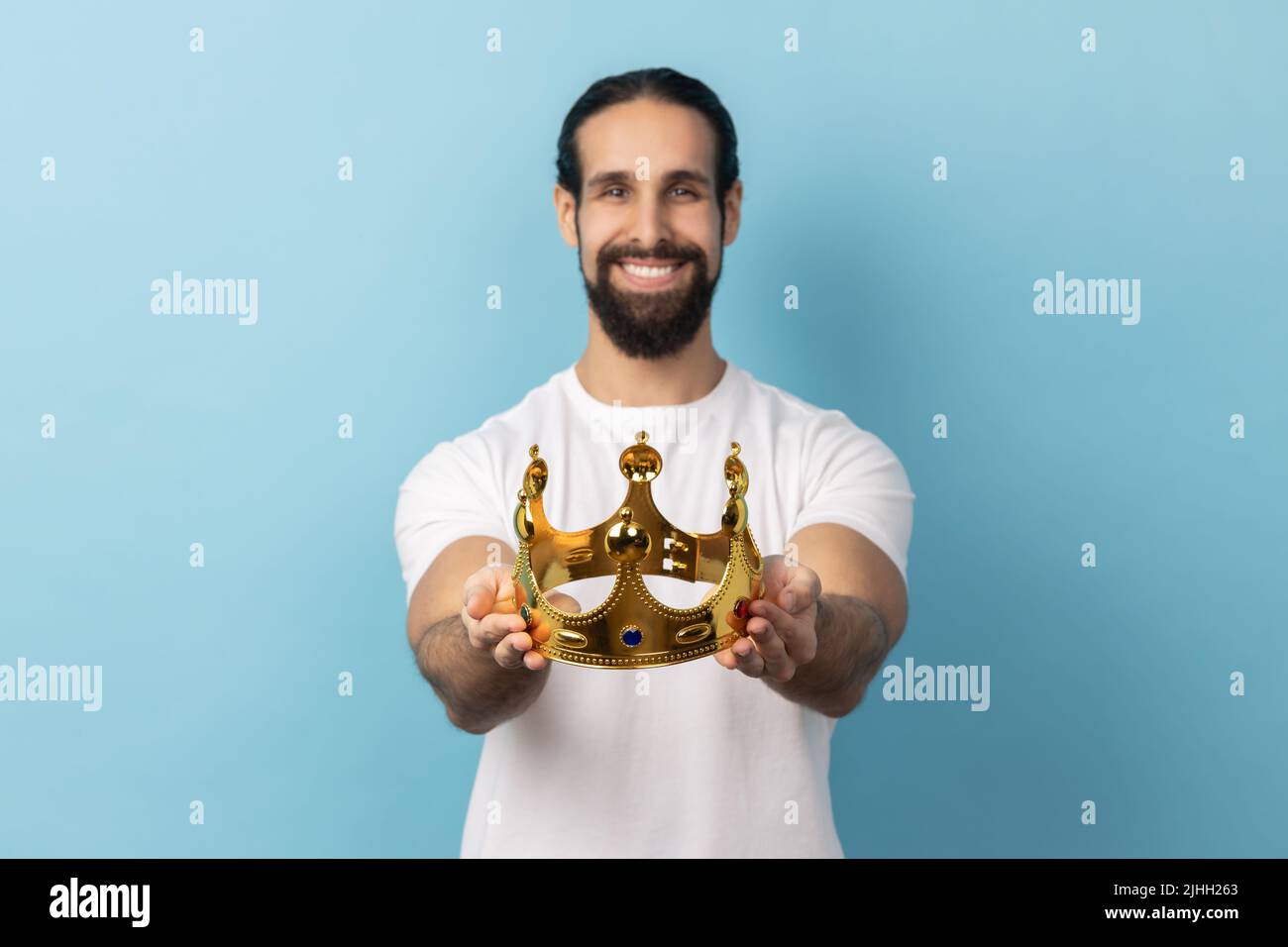 Portrait of smiling happy kind man with beard wearing white T-shirt ...