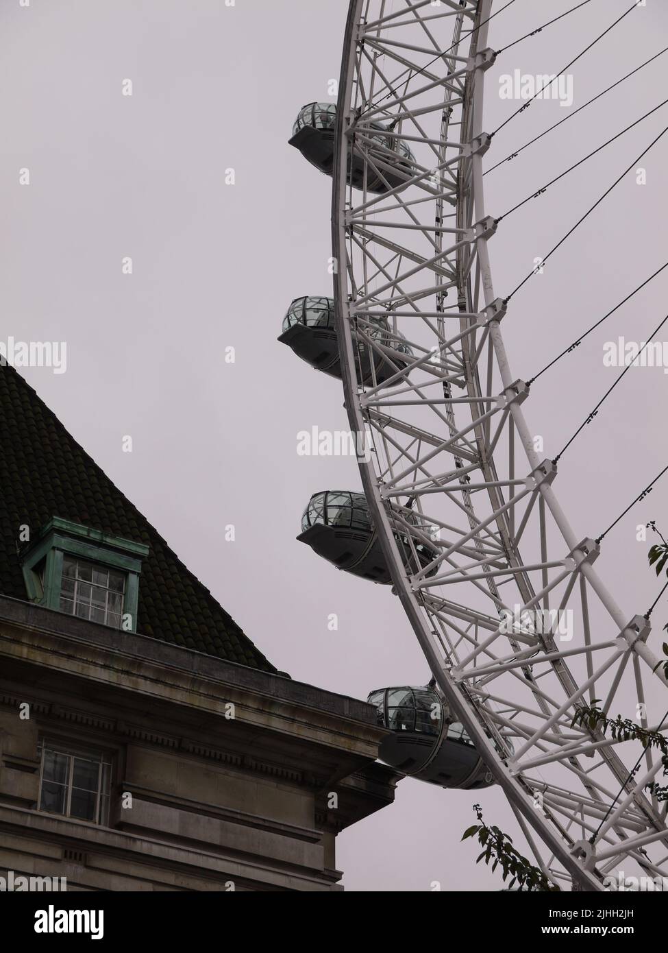 A passenger capsule of the London Eye appears to land on the roof of ...
