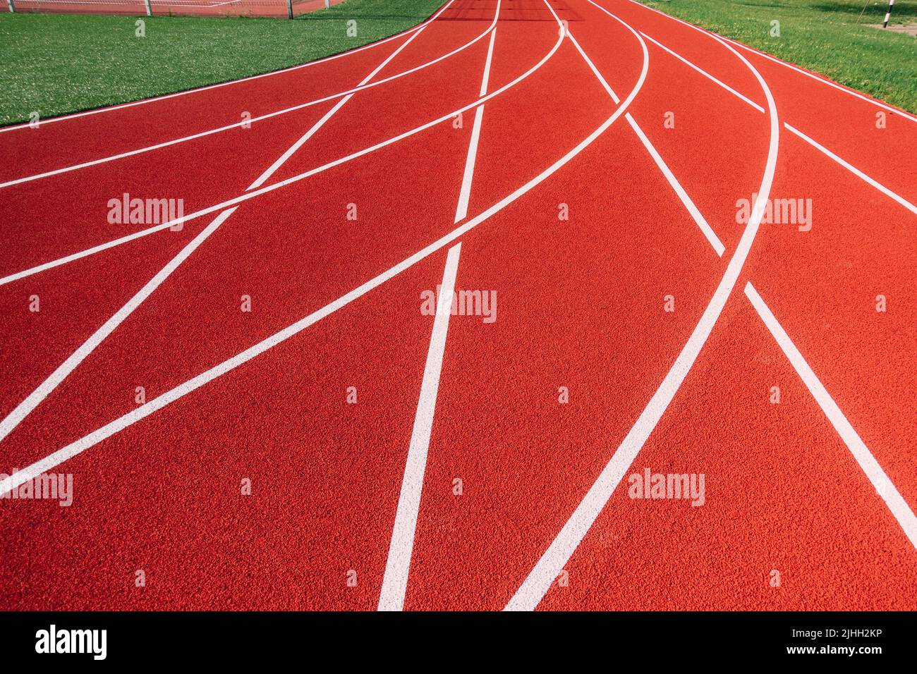 Sports stadium with red artificial rubber ground running tracks white ...