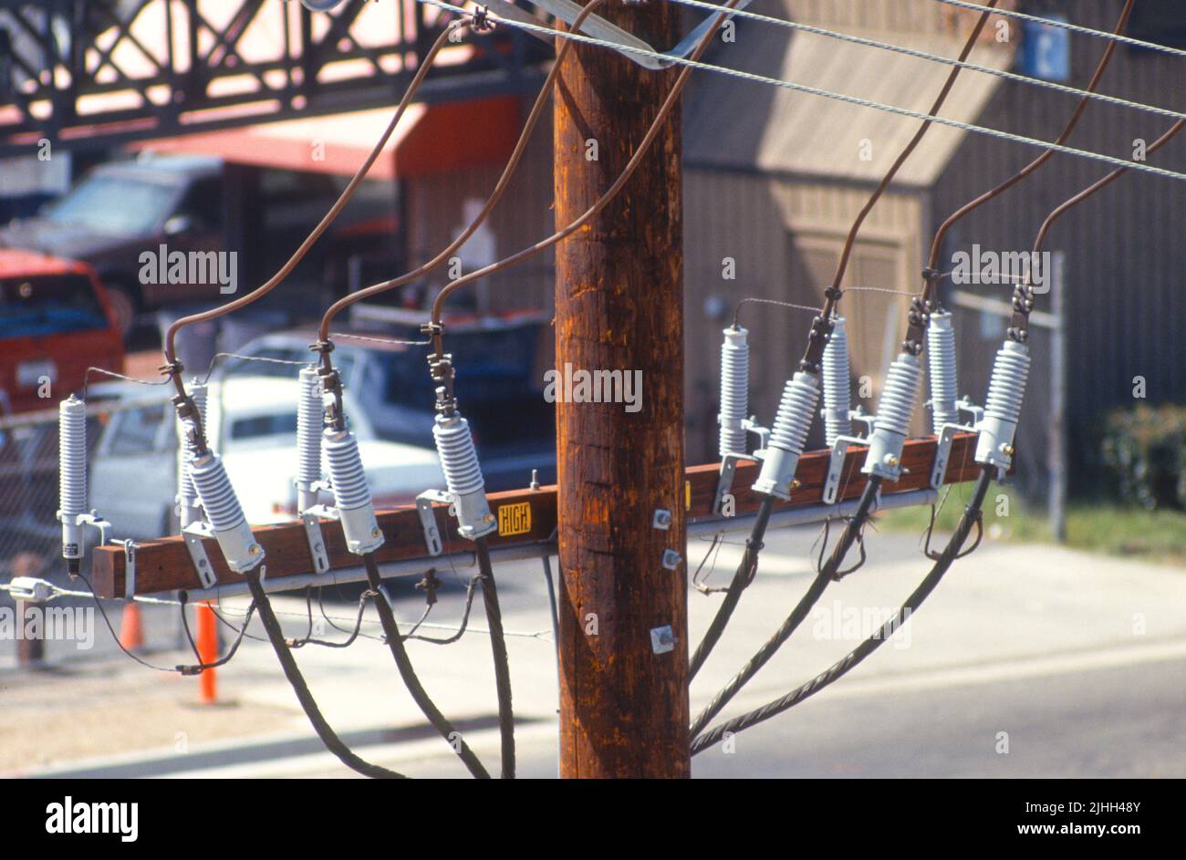 Power line insulators and fuses on a power pole Stock Photo - Alamy