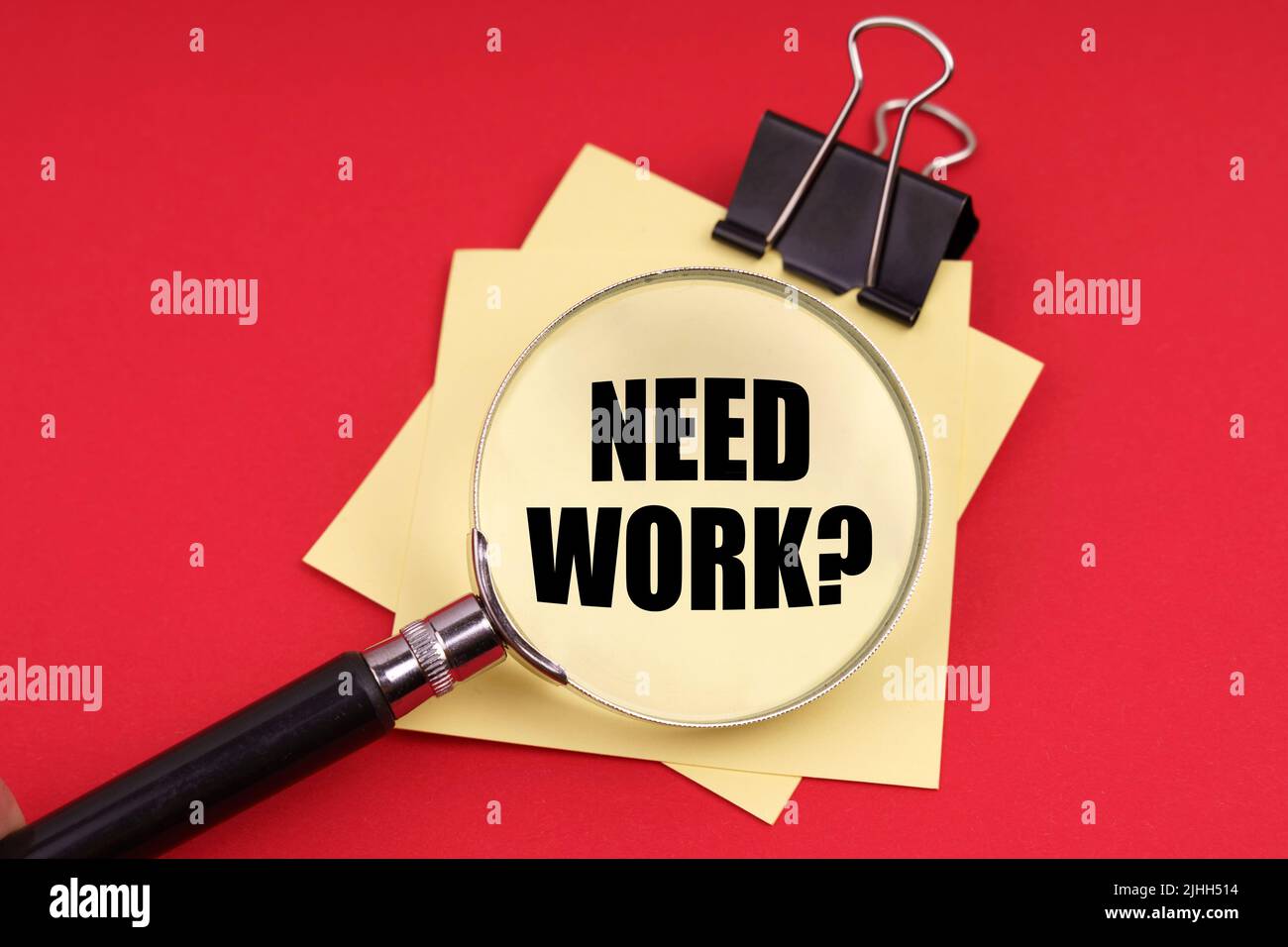 Business and Economics. On a red background, a magnifying glass and a ...