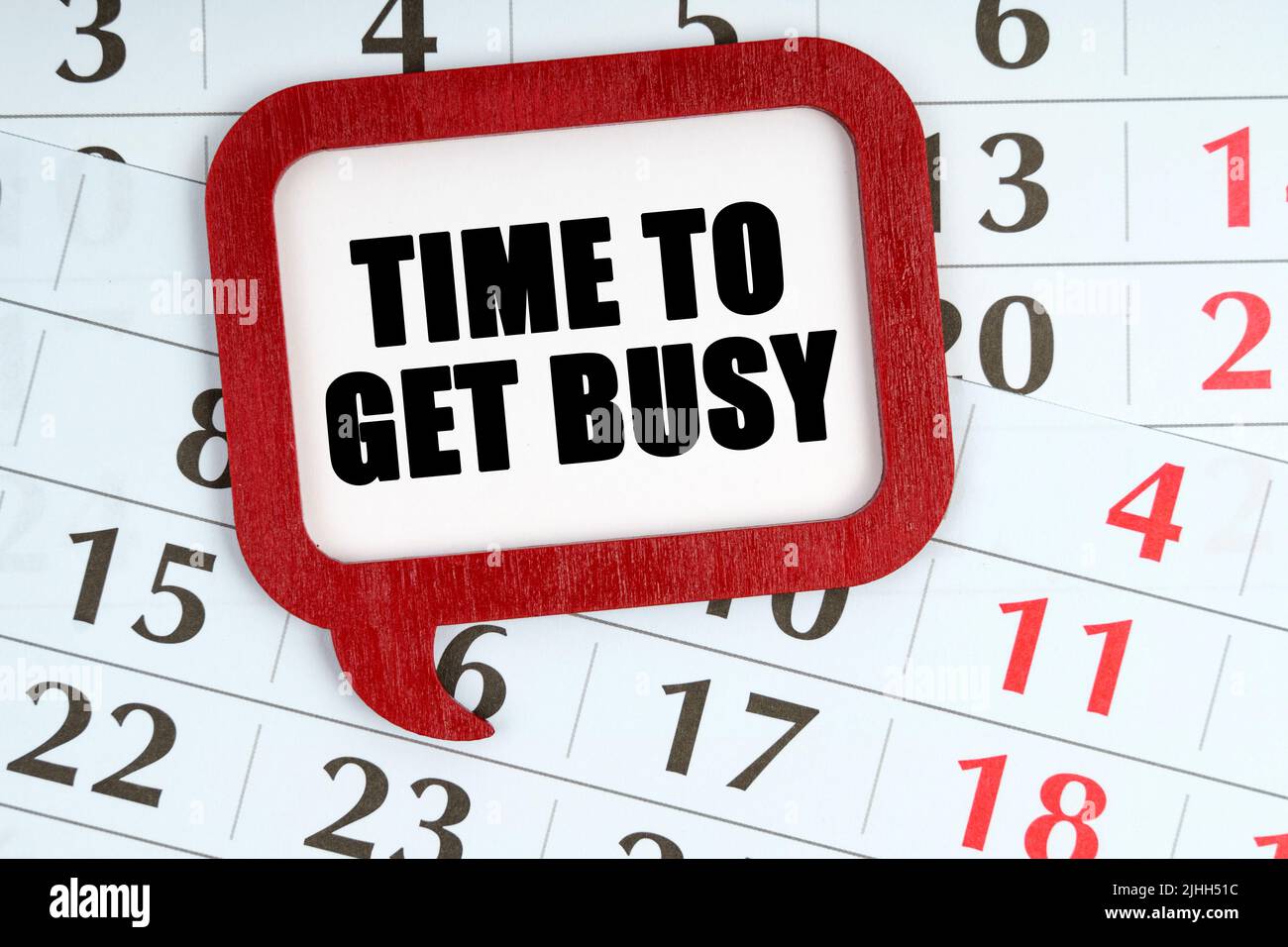 Business concept. On the calendar, a red plaque with the words inside ...