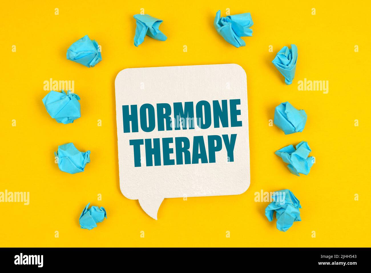 Medicine concept. On a yellow background, blue pieces of paper and a ...