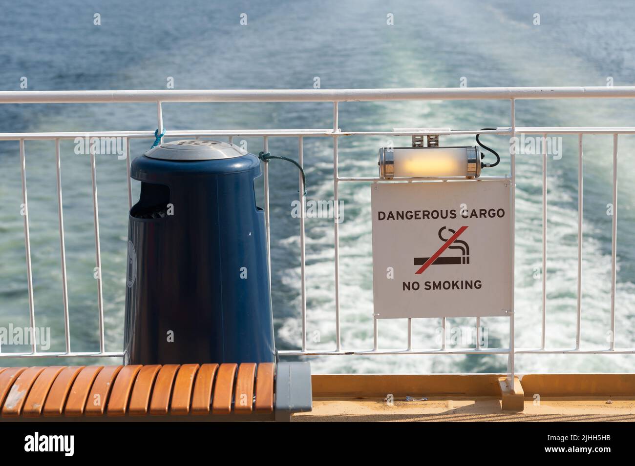 Hirtshals , Denmark - April 22 2011: Trash can and warning sign on aft ...