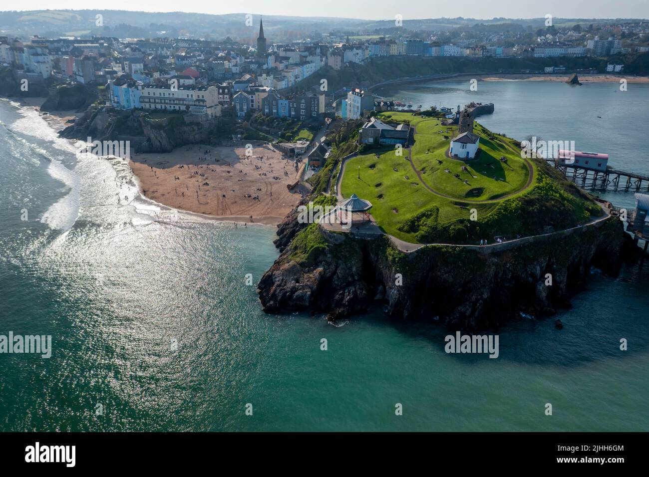 Aerial drone view of a beautiful coast town with sandy beaches and ...