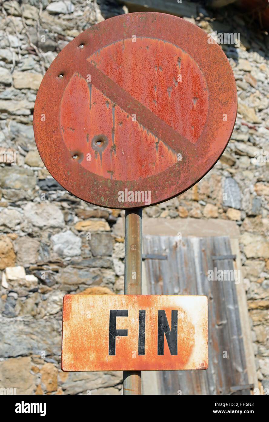 road sign no parking with bullet holes used by hunters as a target with ...