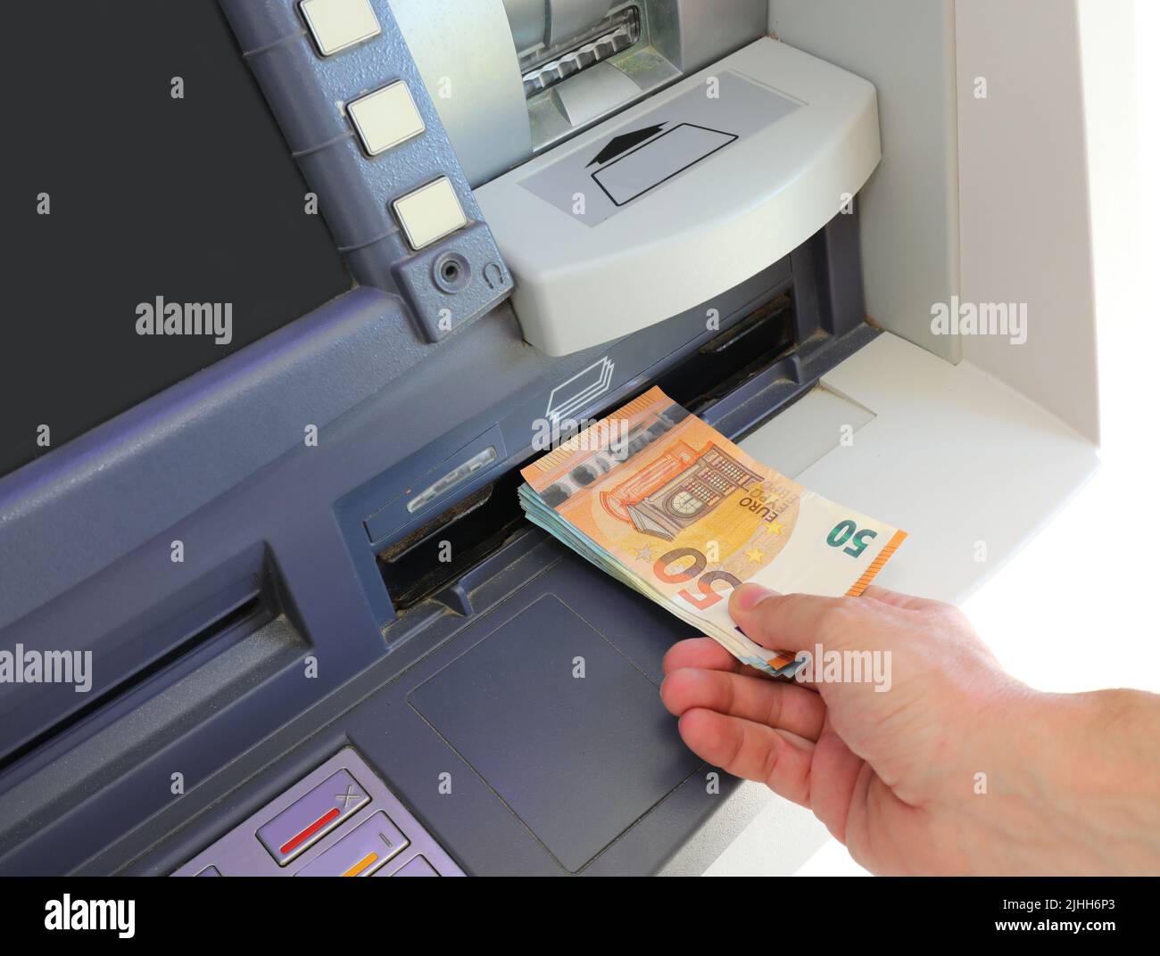 automatic teller machine in europe while distributing banknotes with ...