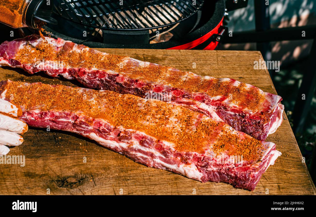 Raw Pork ribs with a spices (rub) for BBQ Stock Photo - Alamy
