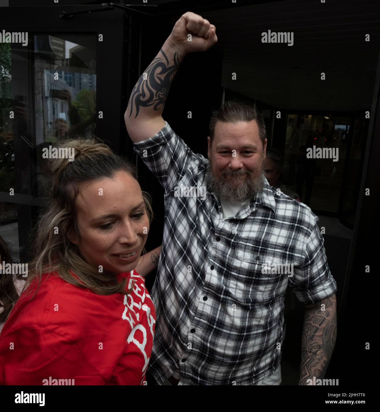 Pat King pumps his fist in the air as he emerges from the courthouse ...