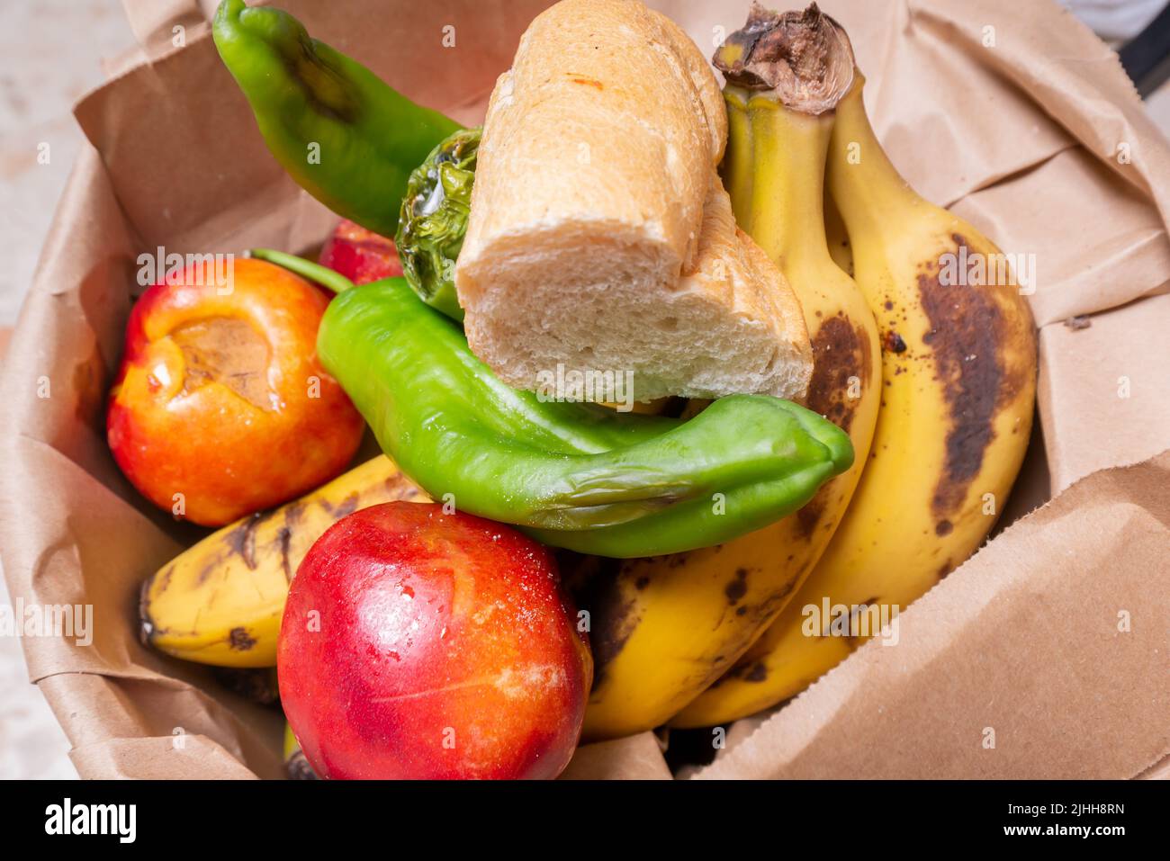 Spoiling Fruit And Bread In A Bin, Symbolic Image Of Food Waste Stock ...