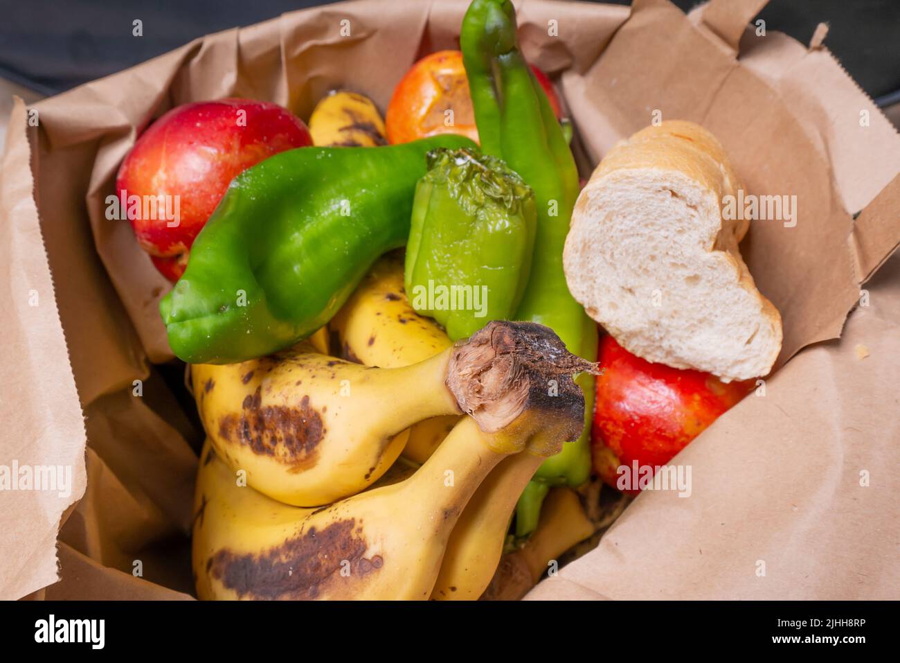Spoiling Fruit And Bread In A Bin, Symbolic Image Of Food Waste Stock ...