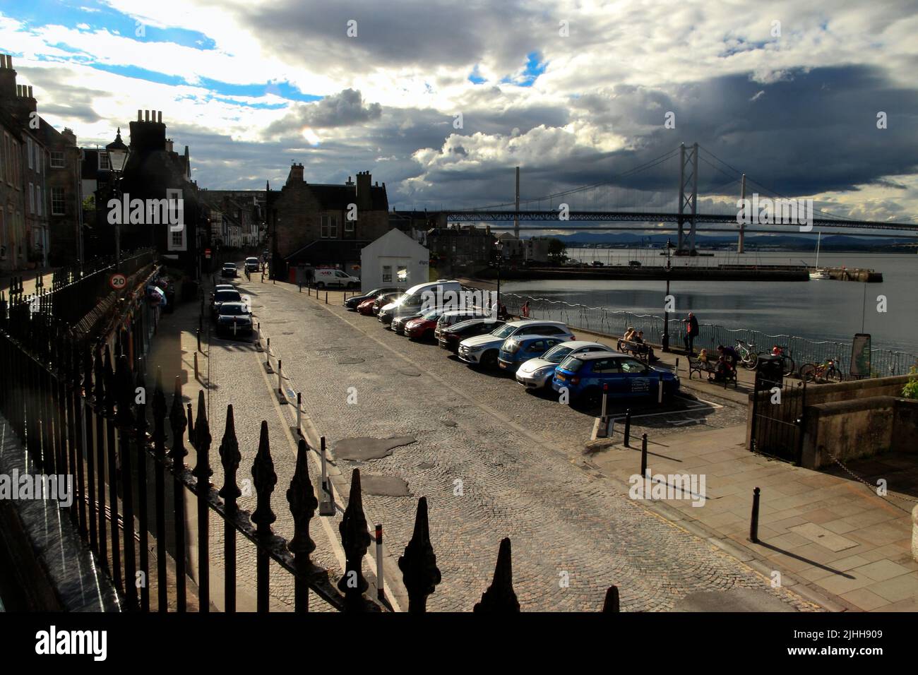Scottish town, Sunlit street along East Terrace, with the Forth Bridges ...