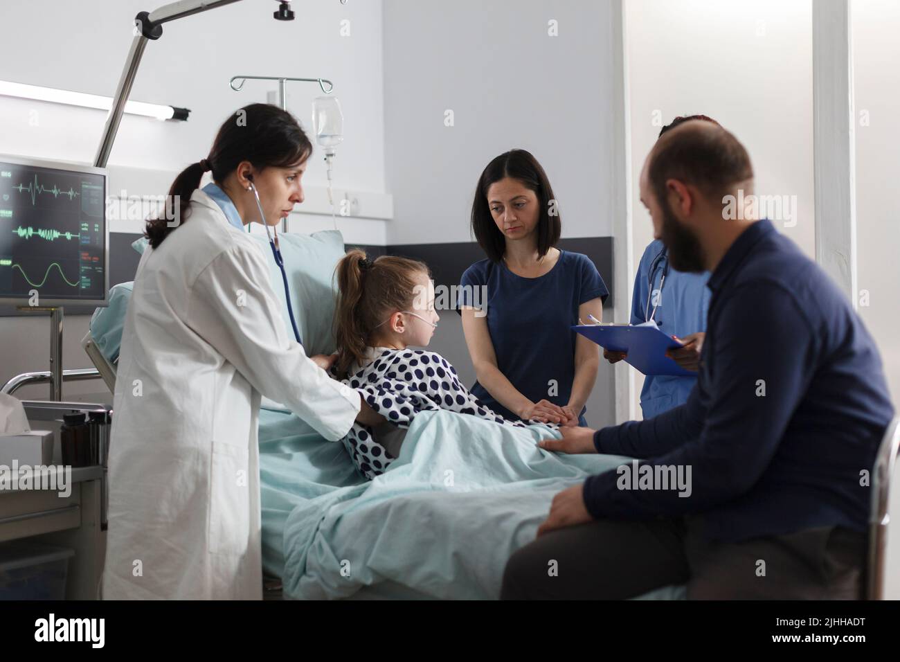 Expert pediatrist checking sick girl health condition using stethoscope ...