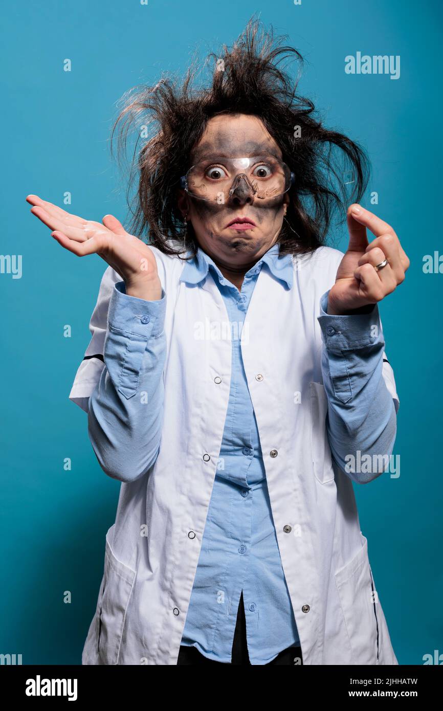 Crazy chemist shrugging arms because she does not know where failed ...