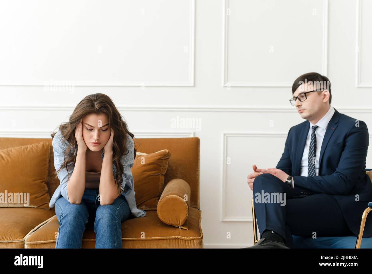 A young worried woman visits a counseling therapist. The girl feels ...