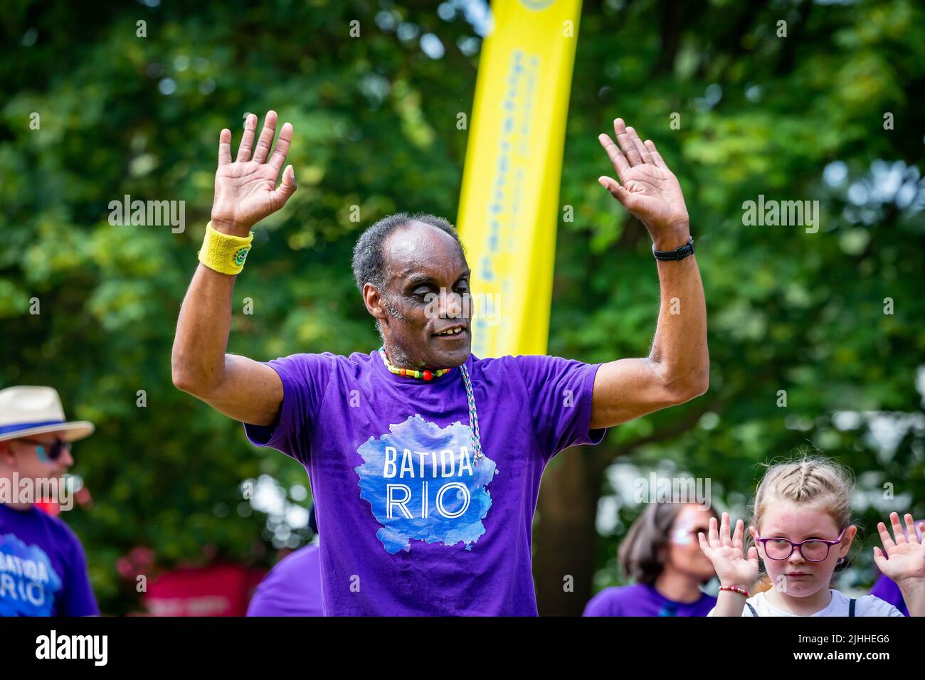 Danny Henry, colourful black dance artist, leads the children in dance ...