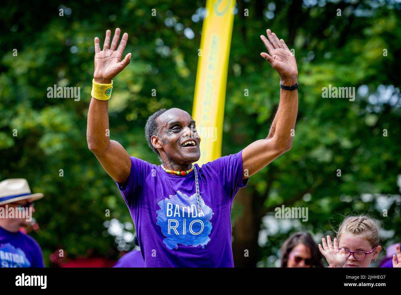 Danny Henry, colourful black dance artist, leads the children in dance ...