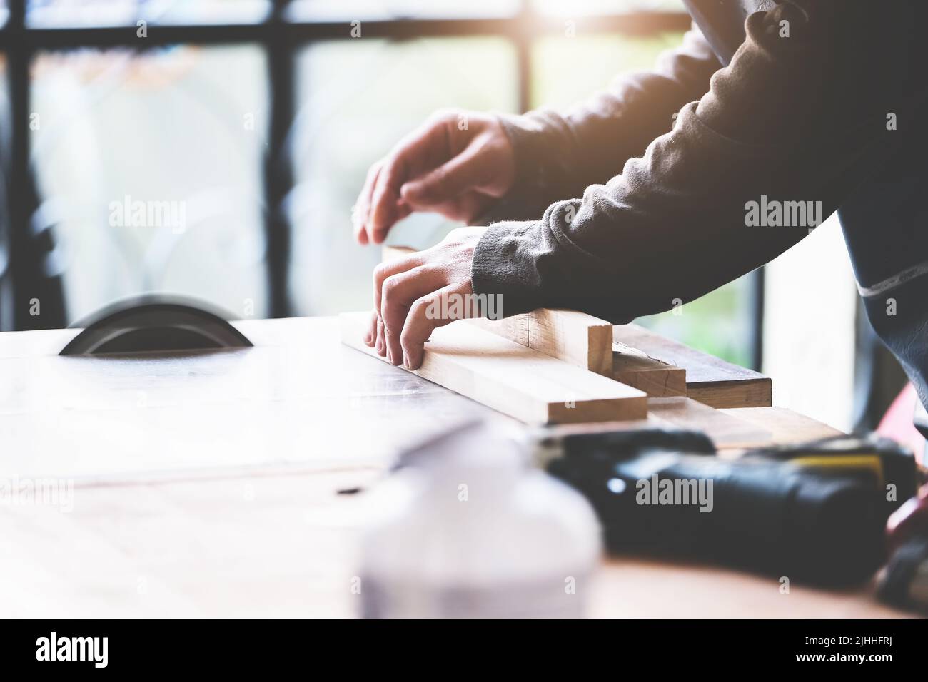 Woodworking practitioners use saw blades to cut wood pieces to assemble ...