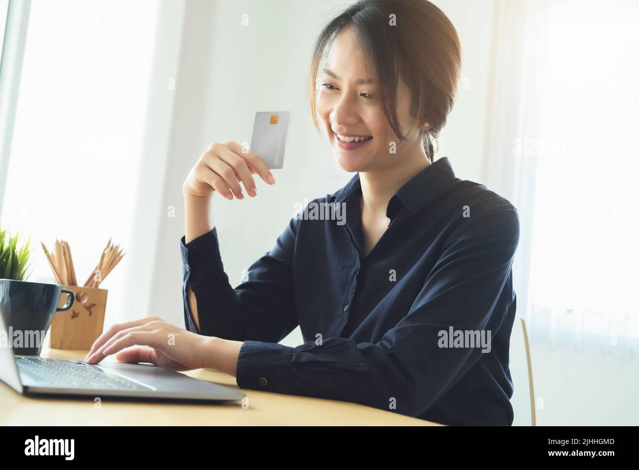 Online payment, Young Women's using computer and hands holding credit ...