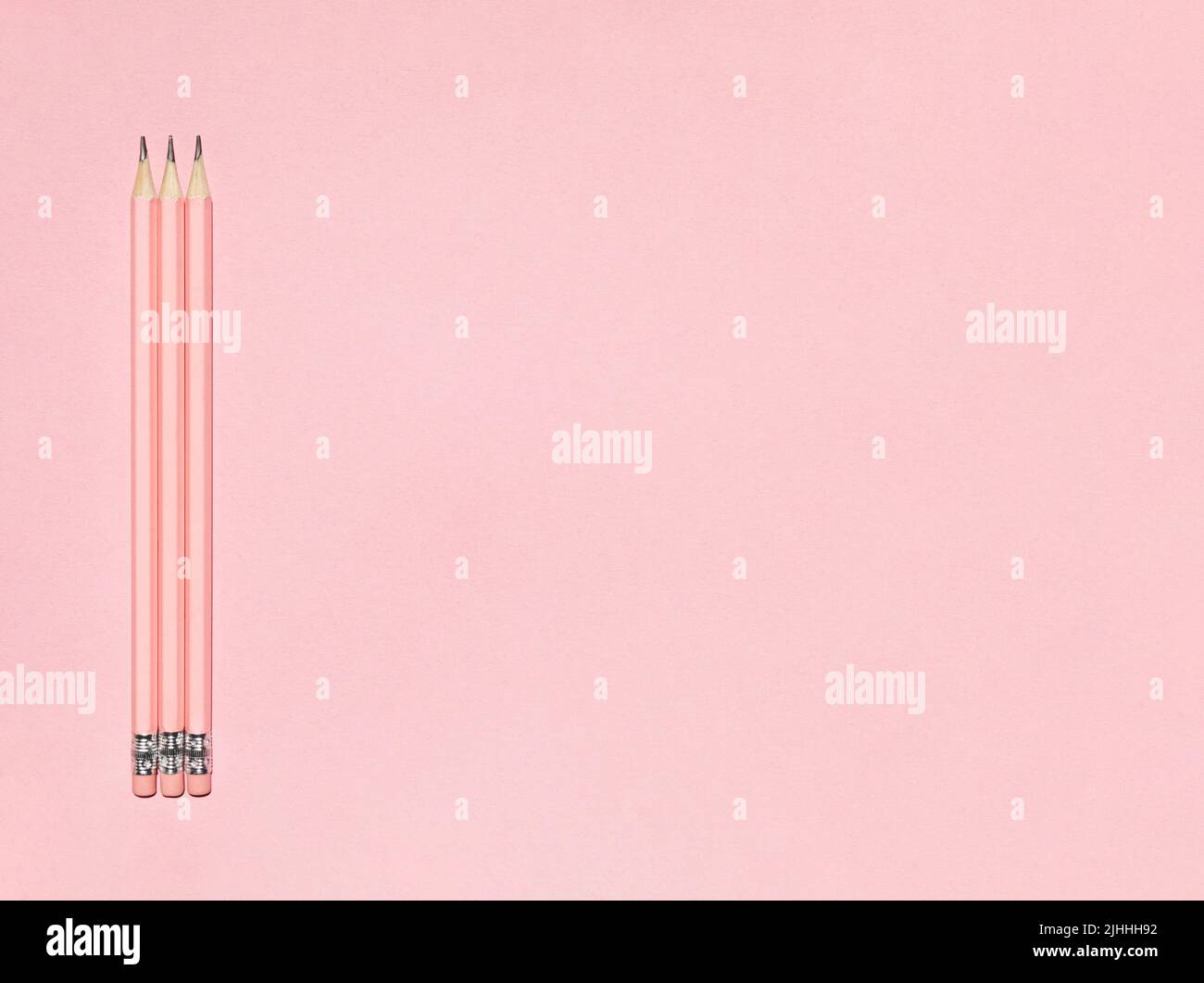 Wooden pastel pink pencils with erasers on pink background. Back to ...