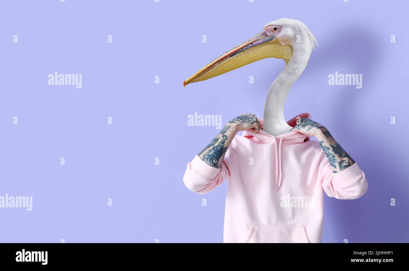Tattooed man with head of pelican on lilac background Stock Photo - Alamy