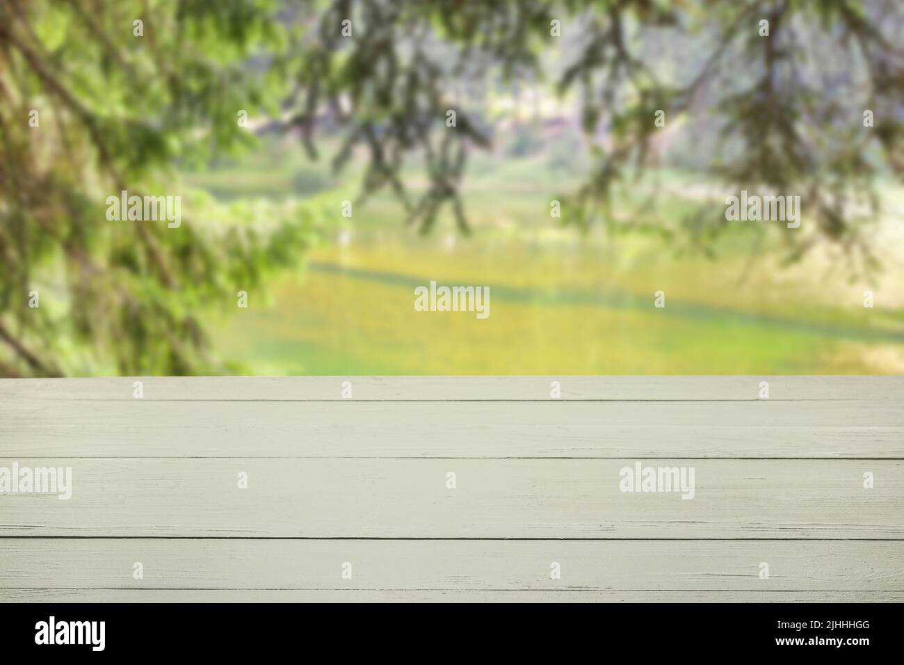 Empty wooden table near lake in forest. Mockup for design Stock Photo ...