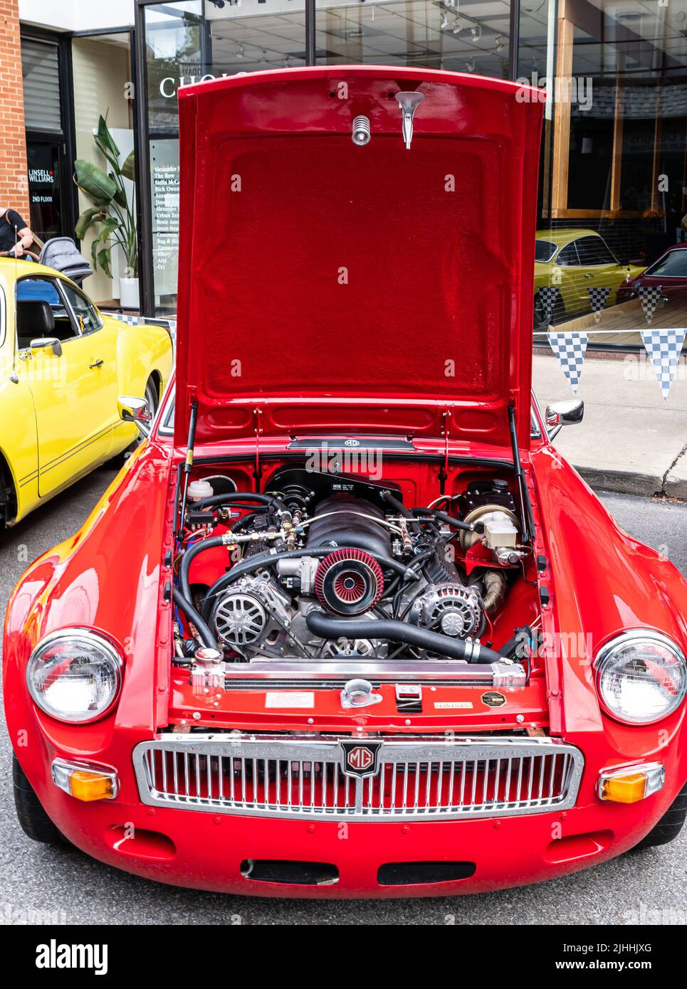 The engine compartment and motor of a red MG coupe at the Shadyside car ...