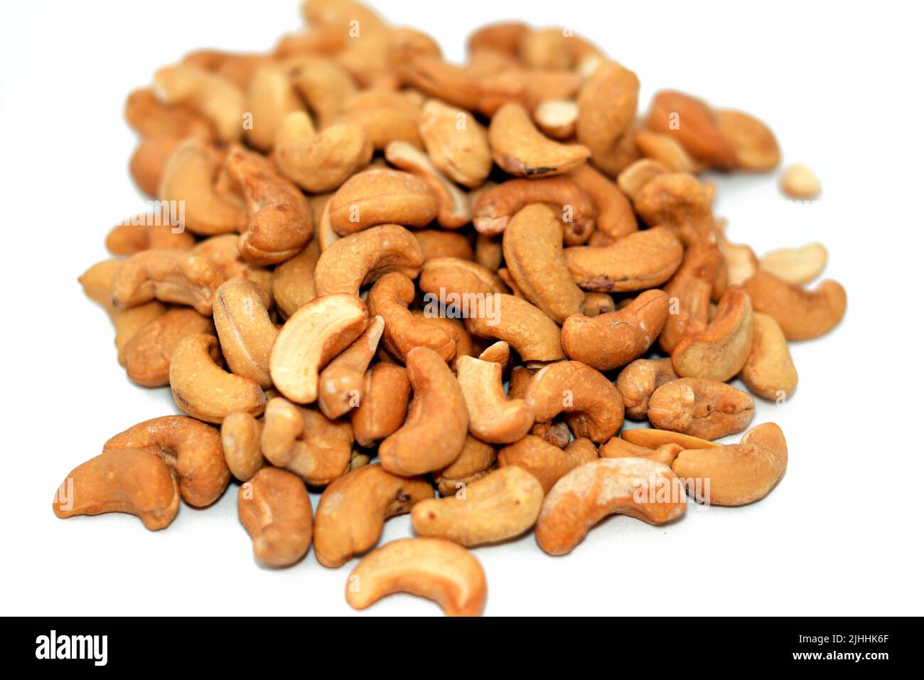pile of peeled roasted salted cashew nuts seeds isolated on white ...