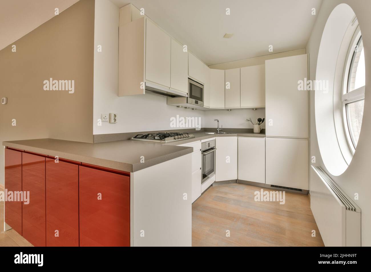 Interior of empty white kitchen with corridor and wooden parquet floor ...
