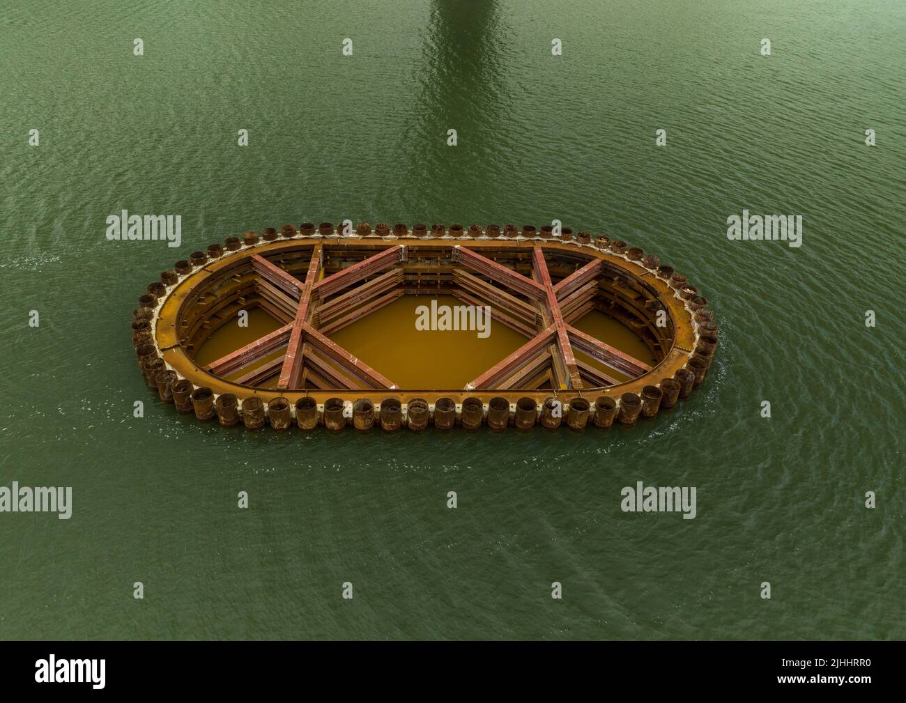 Overhead view of coffer dam holding back river water on bridge ...