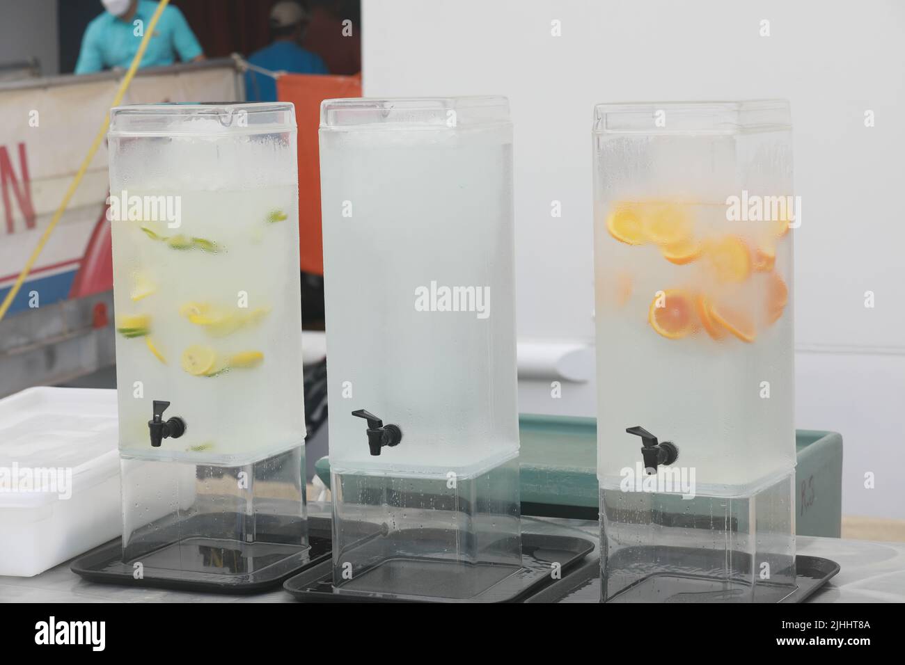 Refreshing transparent tanks with cold water and different flavors as ...