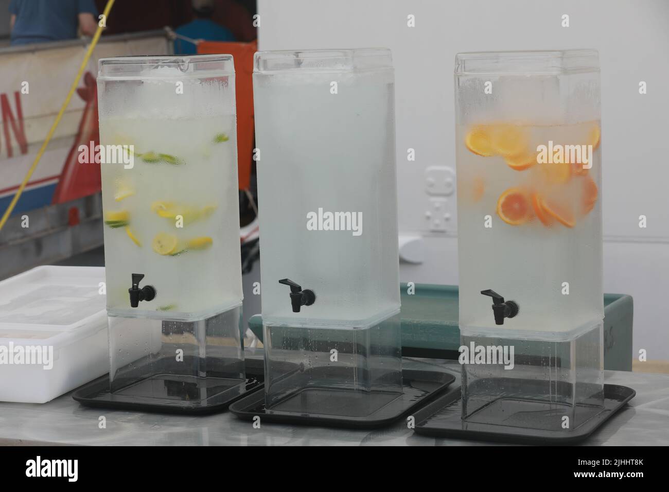 Refreshing transparent tanks with cold water and different flavors as ...