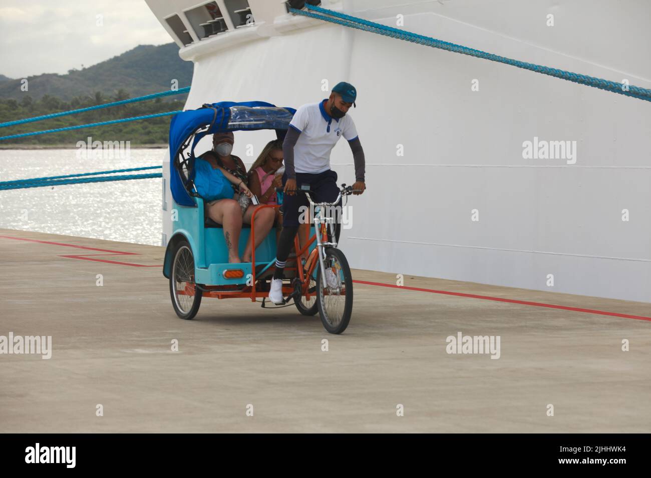 Bicycle rickshaw transferring guests from cruise ship terminal complex ...